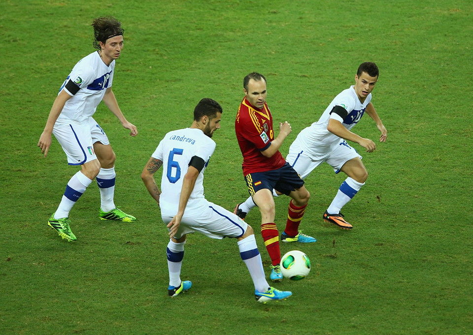Iniesta surrounded by players of Real Madrid, Czech Republic, Croatia ...